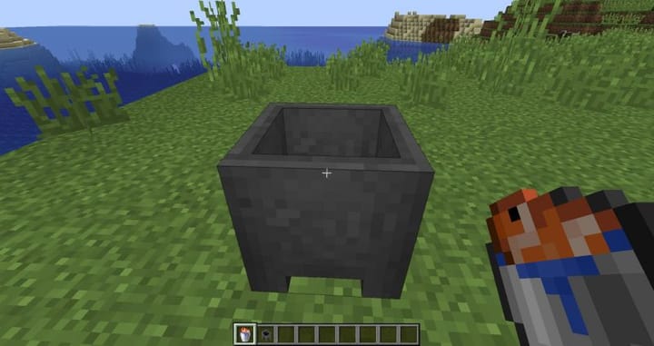 What is a cauldron used for in Minecraft?