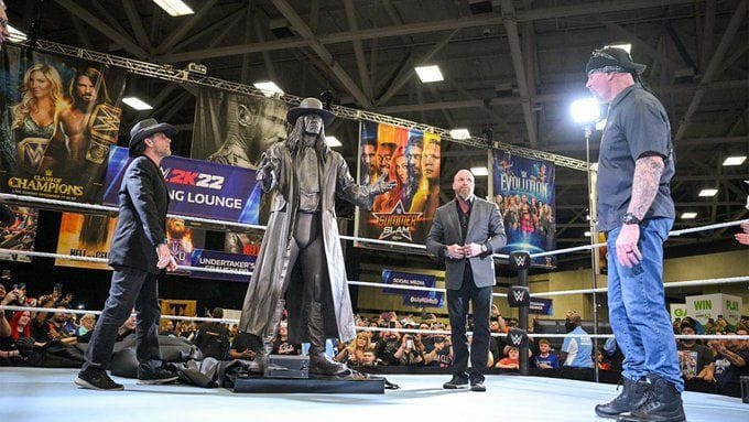 The Undertaker gets congratulated by Trish Stratus