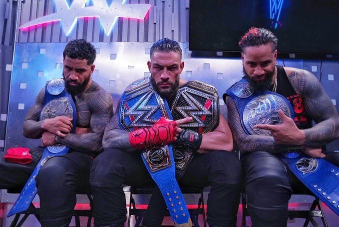 What is the red necklace that Roman Reigns wears?