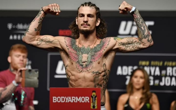 Professional tattoo artist assesses Sean O'Malley's ink