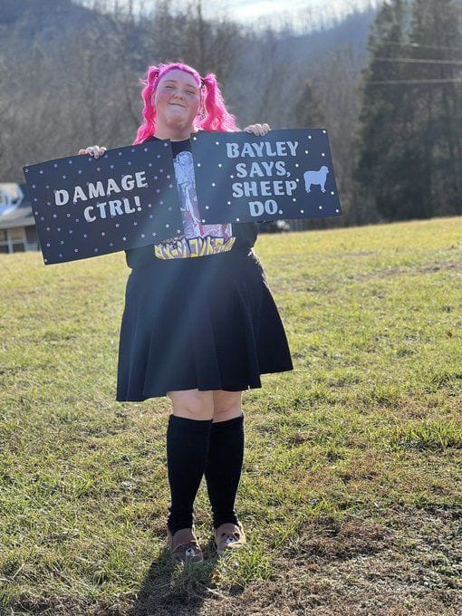 Bayley tears up a WWE fan's poster; sends four-word 'insult' afterward ...