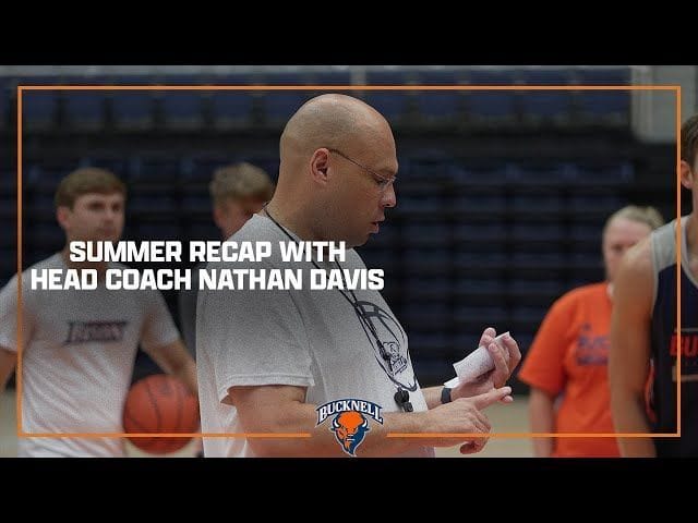 Who is Nathan Davis, and what was his coaching record with Bucknell Bison?