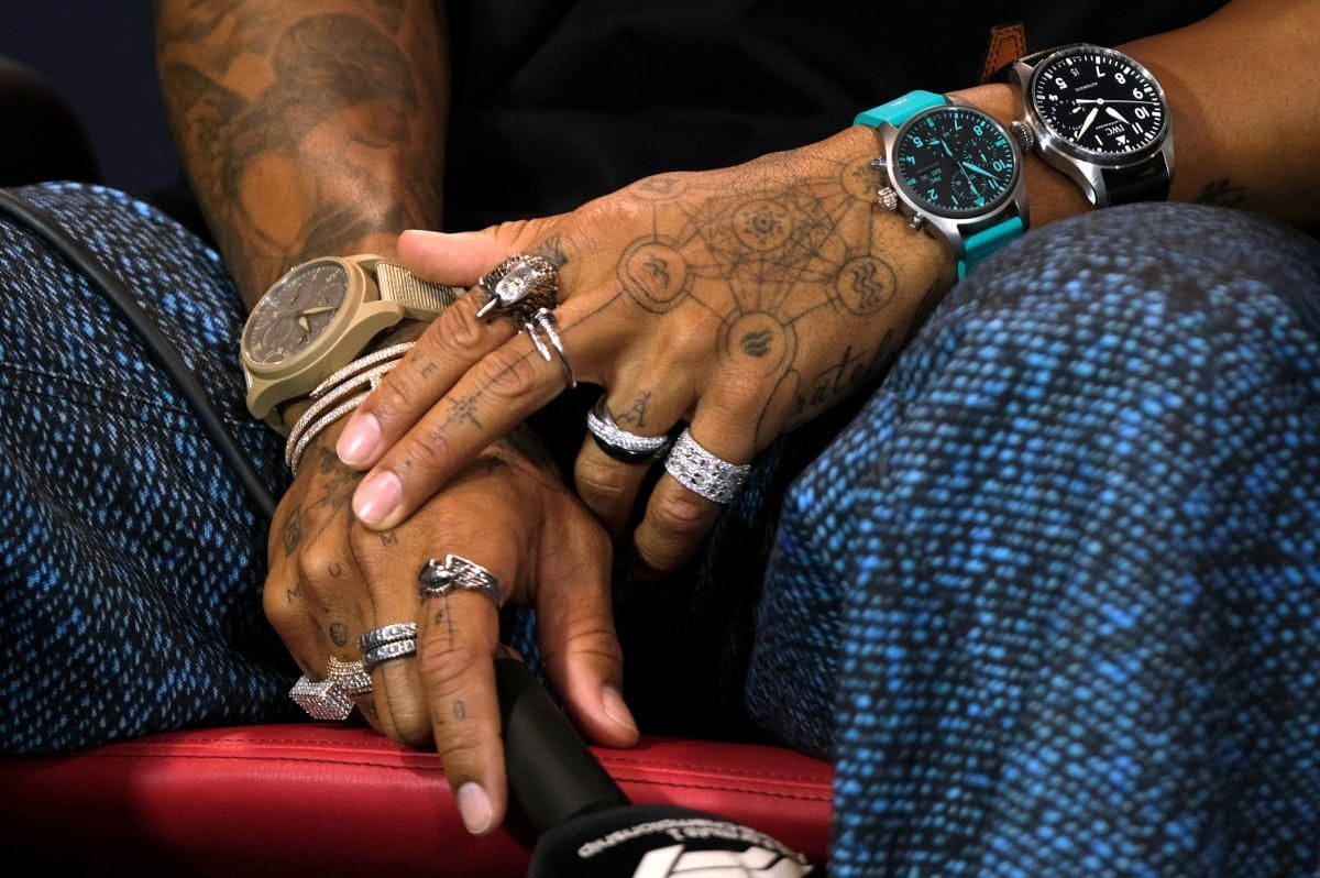 What do Lewis Hamilton's hand tattoos mean?