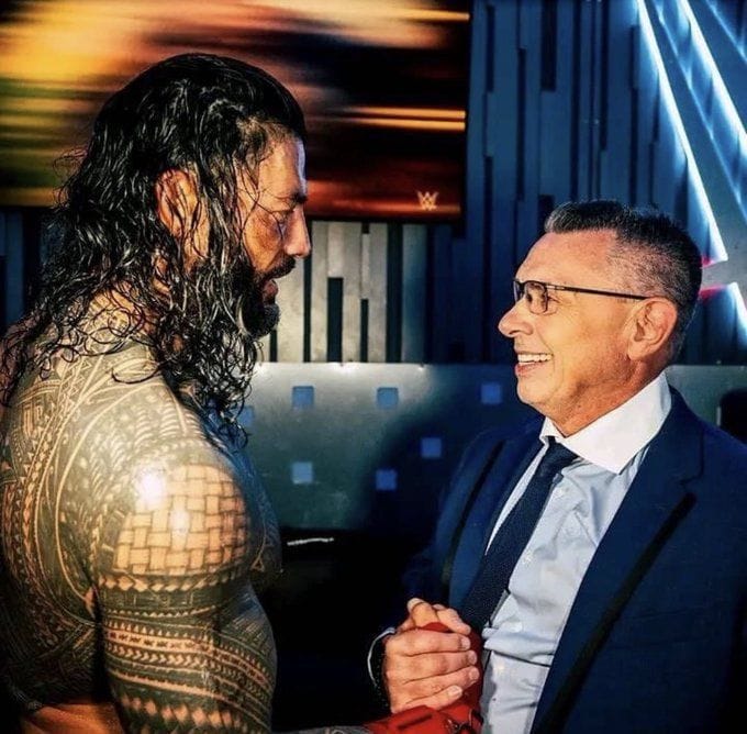 "Two GOATS" - Fans go crazy over Roman Reigns' backstage photo with 26 ...