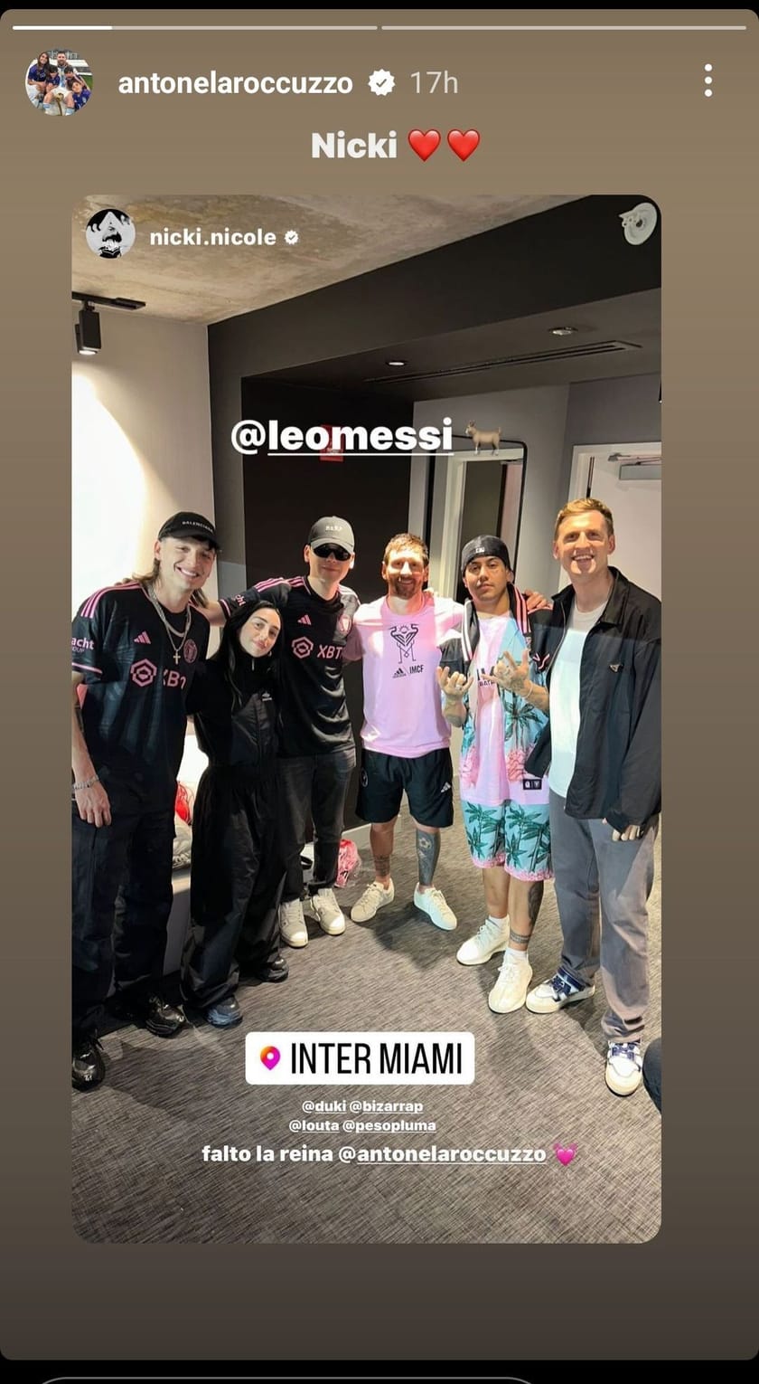 Antonela Roccuzzo reacts as Lionel Messi is photographed with ...