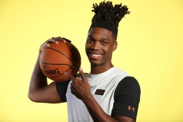 What is the story behind Lonnie Walker's haircut?
