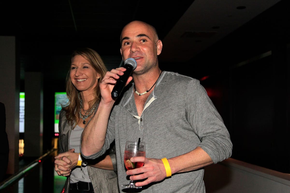 Andre Agassi all smiles as he poses with wife Steffi Graf ahead of ...