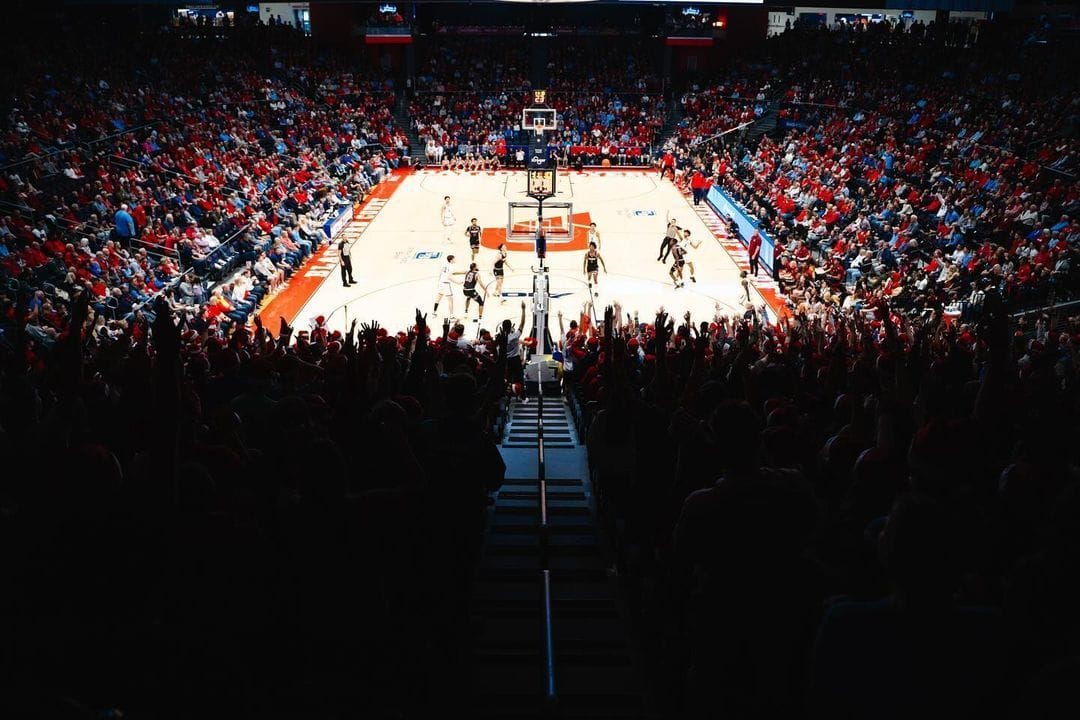 What are the dimensions of a college basketball field?