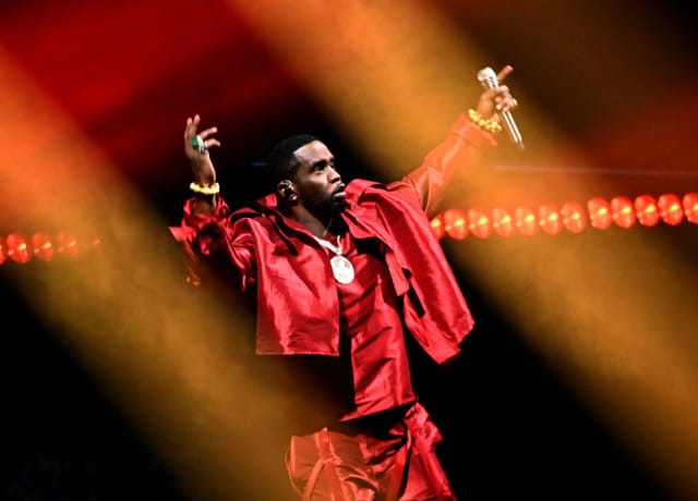 Diddy greets paparazzi with prayer hands and "love" sign after his ...