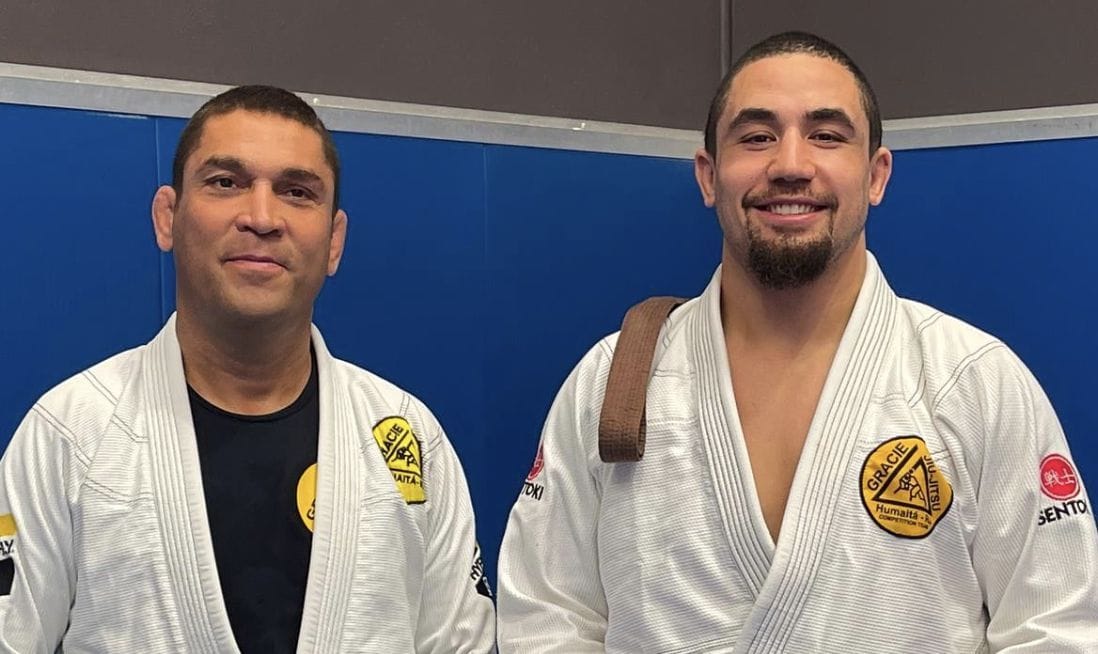 Who trains Rob Whittaker?