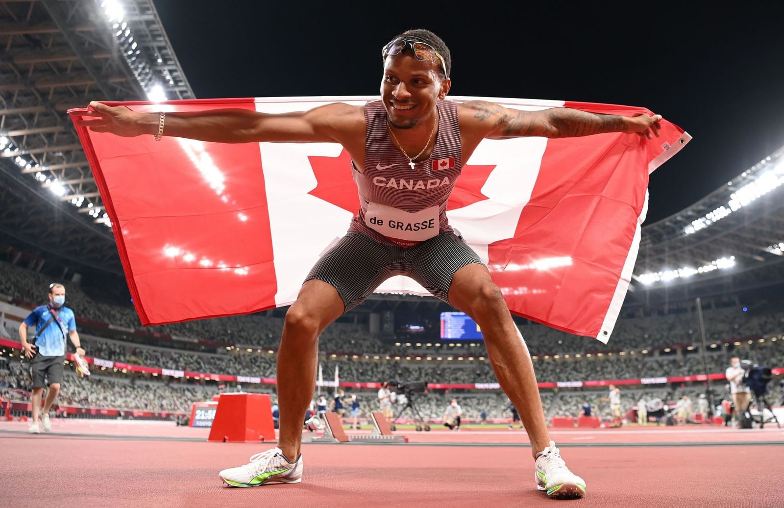 200m reigning Olympic Champion Andre De Grasse receives the honor to lead the Canadian squad as ...