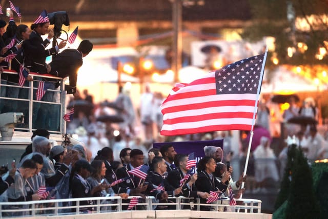 WATCH: Team USA parades with a stacked up boat during the Paris ...