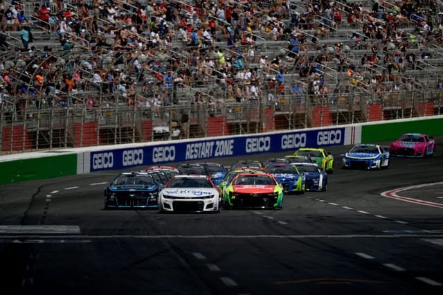 Which NASCAR driver and team has the most wins at Atlanta Motor Speedway?