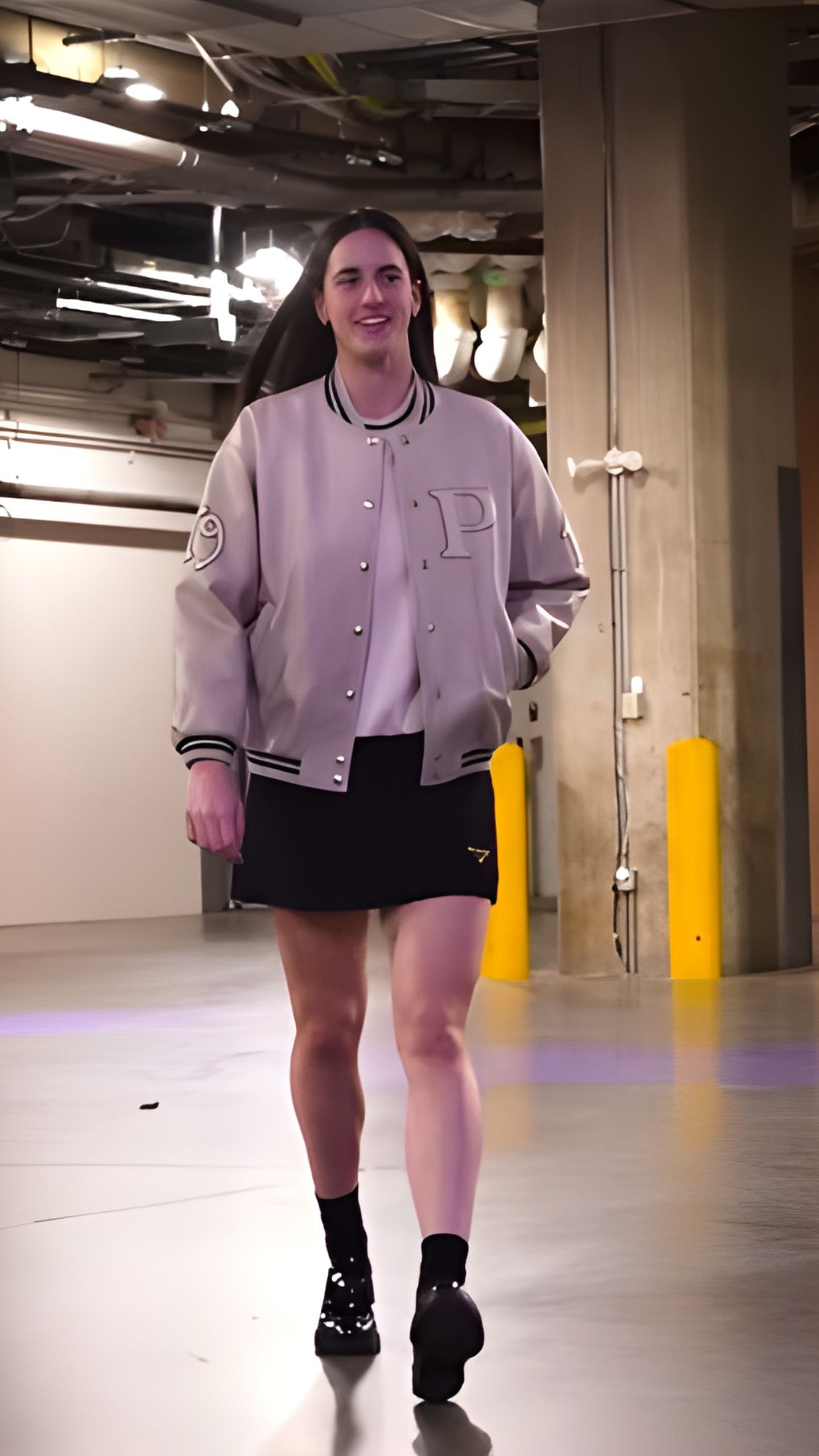 Photos: Caitlin Clark sports $7,312 Prada bomber jacket with short skirt ahead of Fever vs Dream ...