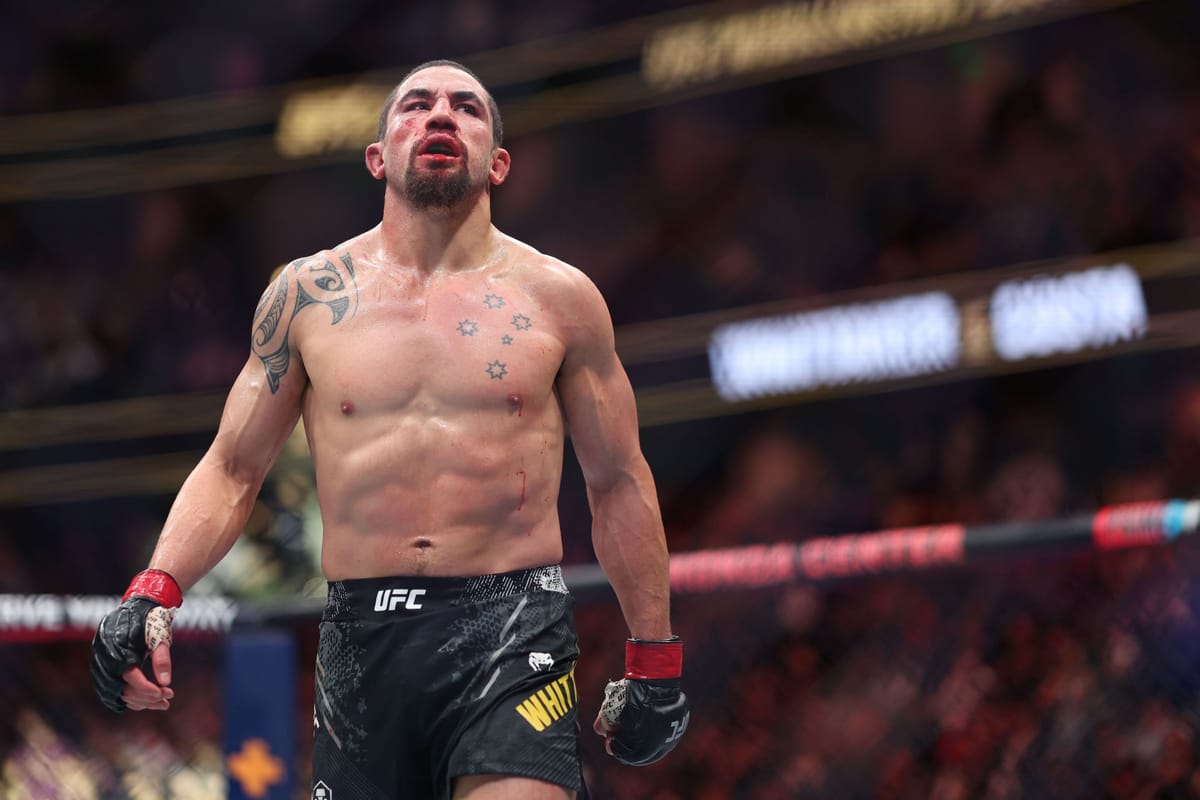 Who trains Rob Whittaker?