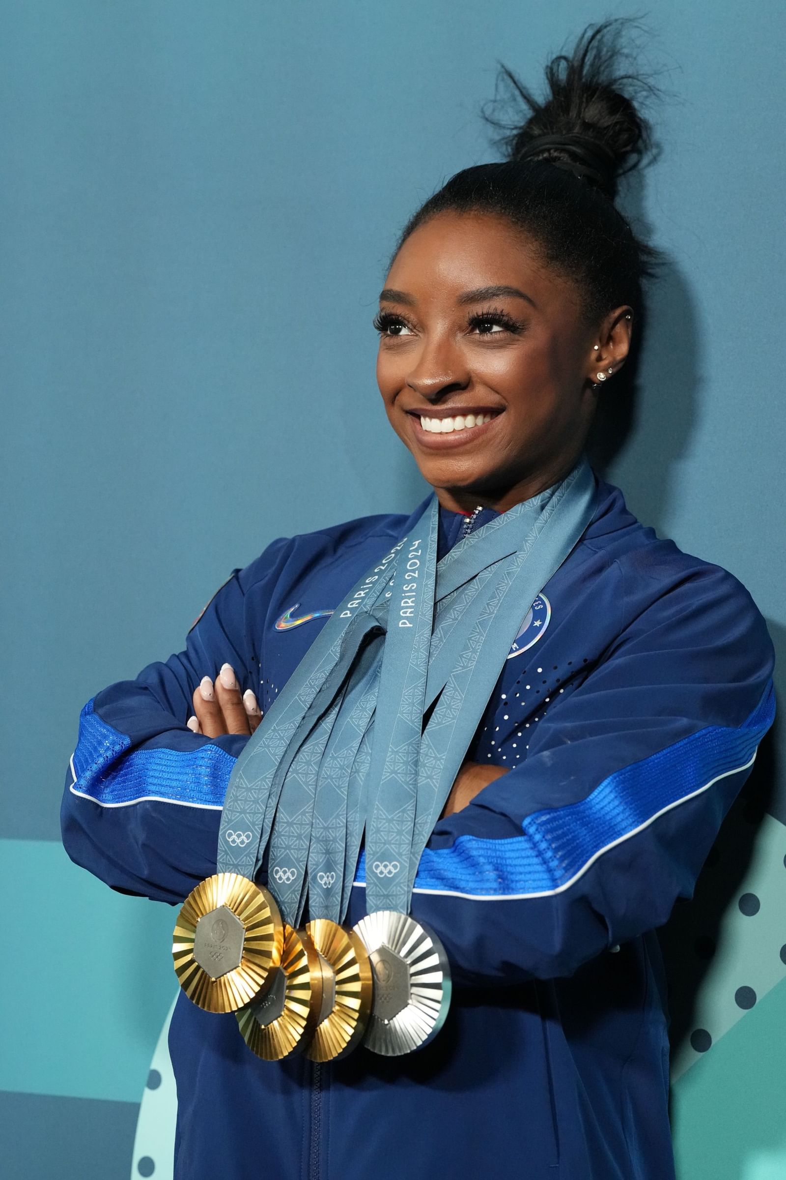In Pictures: Simone Biles turns up the glamour in sparkly mini-dress as ...