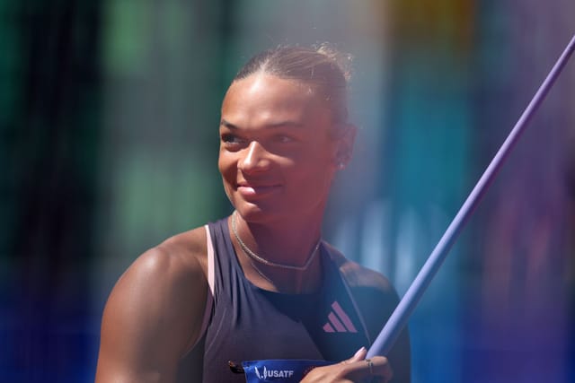 Anna Hall shares a two-word description for her coach as she extends ...