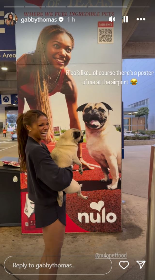 Gabby Thomas gushes over a poster with her pet at the airport as they ...