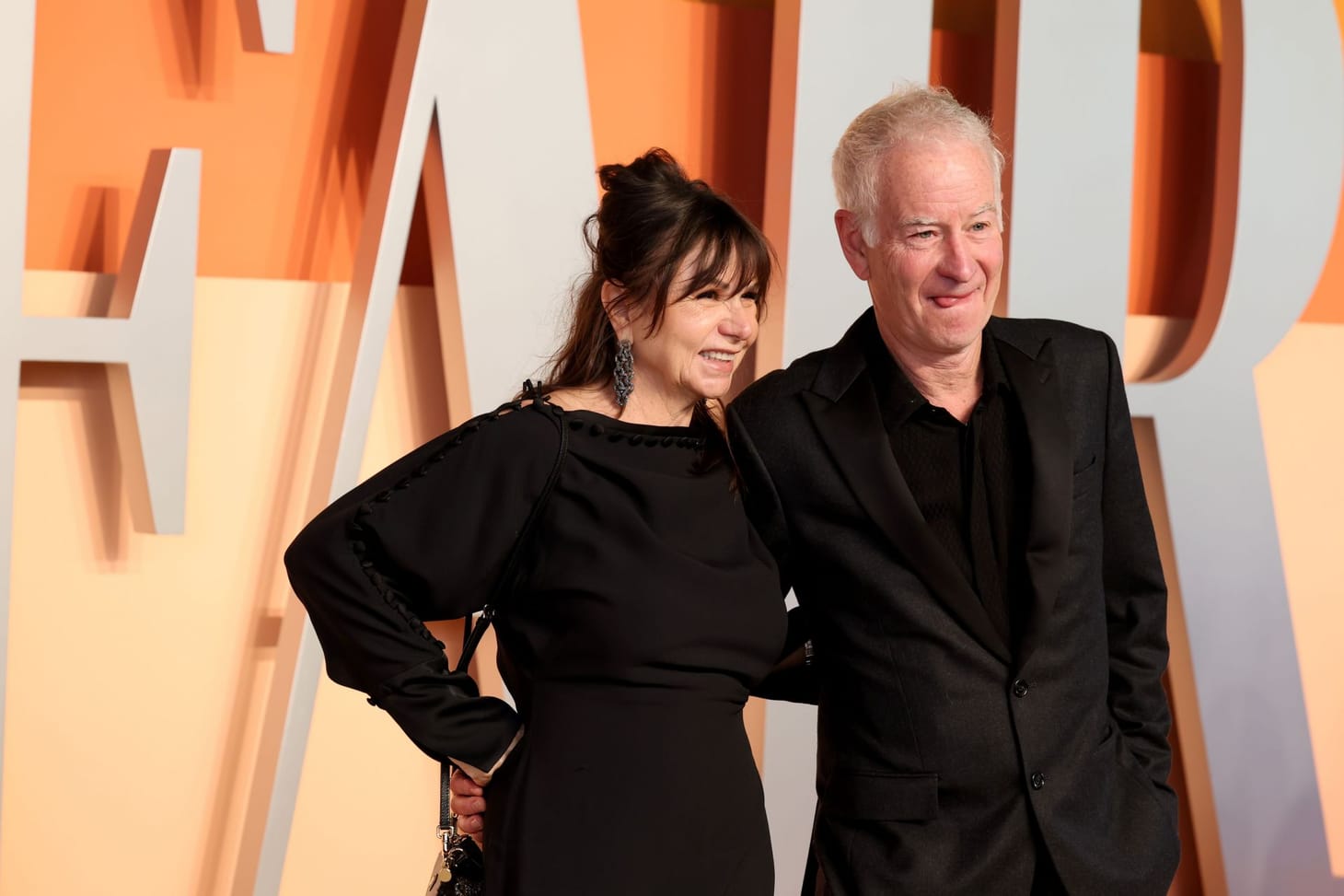 John McEnroe rocks out on stage with daughter Emily, covers wife Patty ...
