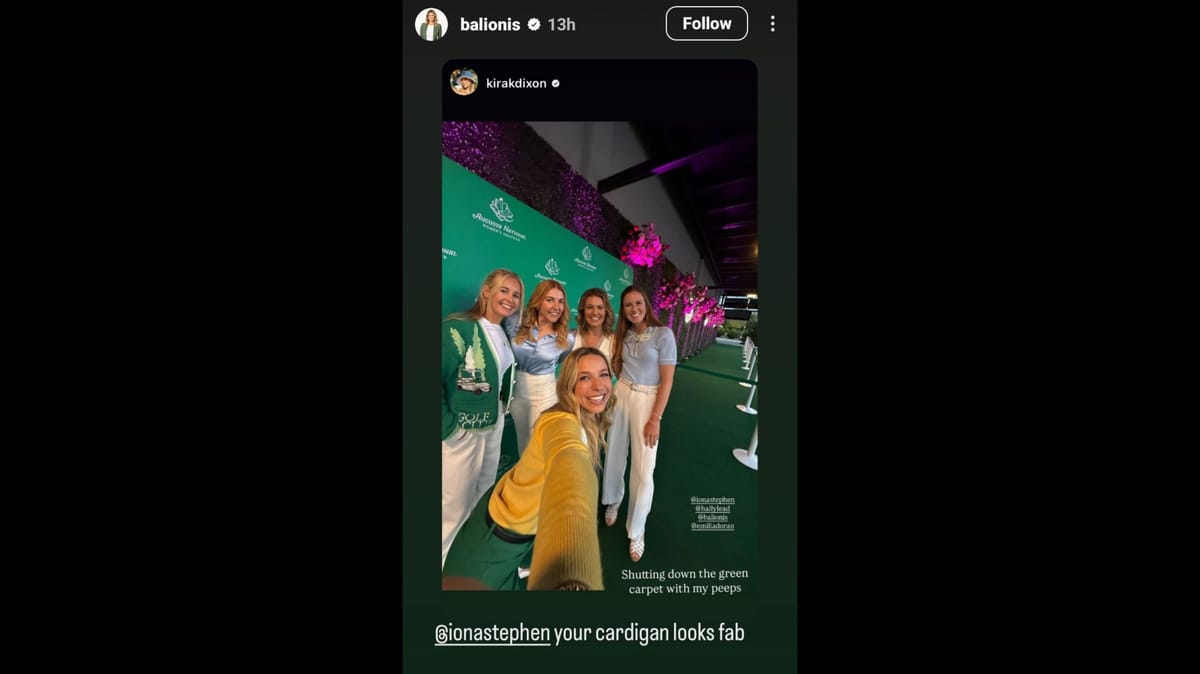 Amanda Balionis poses with her crew in all white to give 2-word message