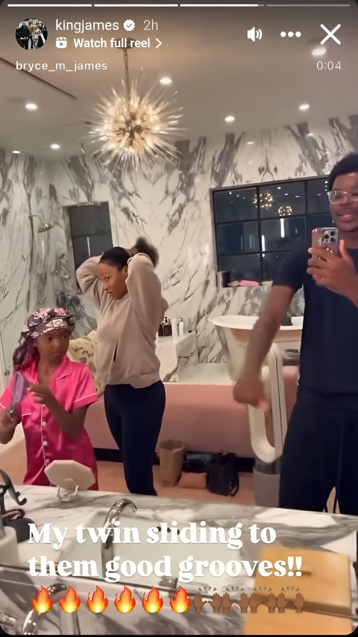 LeBron James hypes his "twin" Bryce James as he jams around with ...