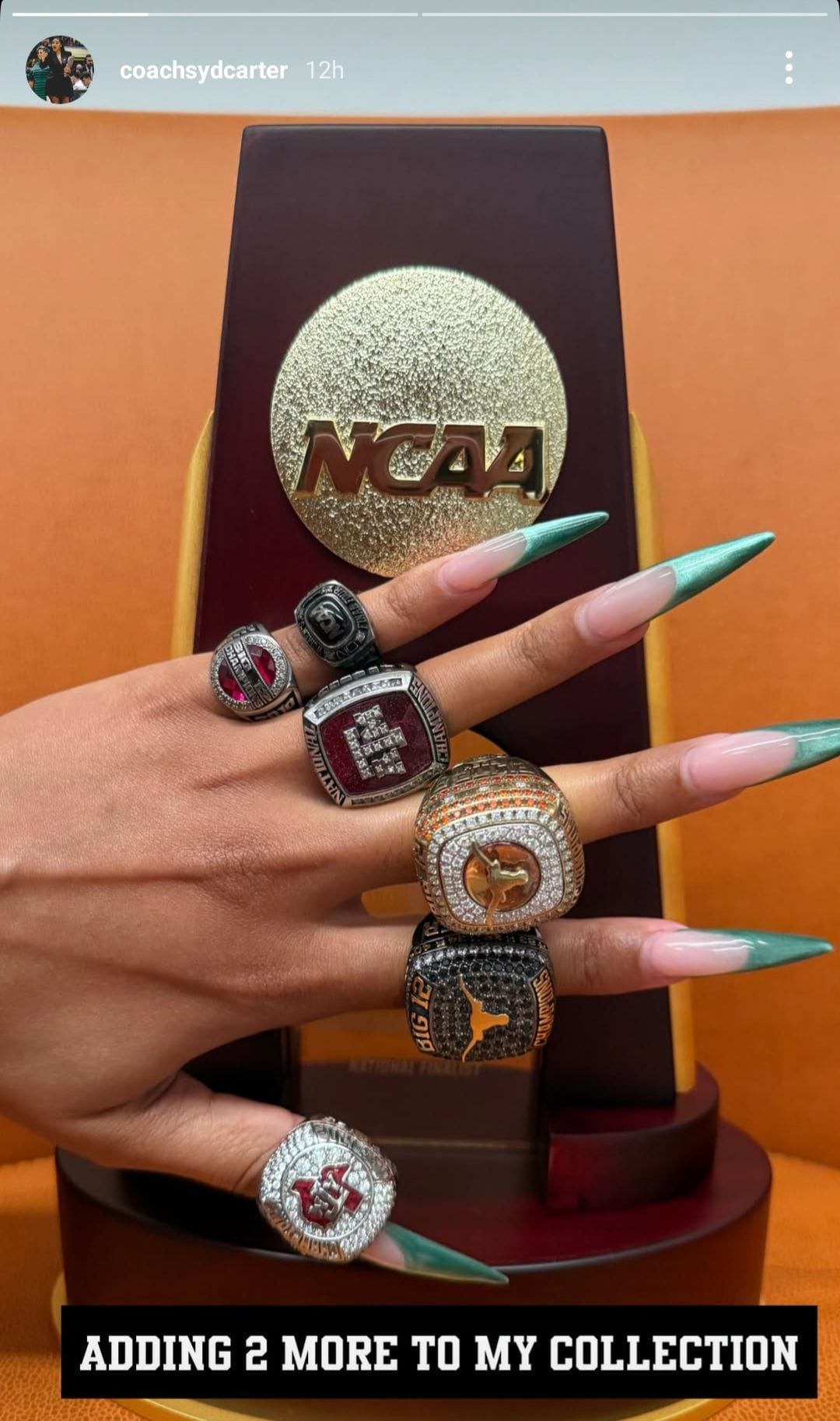 Texas assistant coach Sydney Carter flexes SEC championship trophy with ...