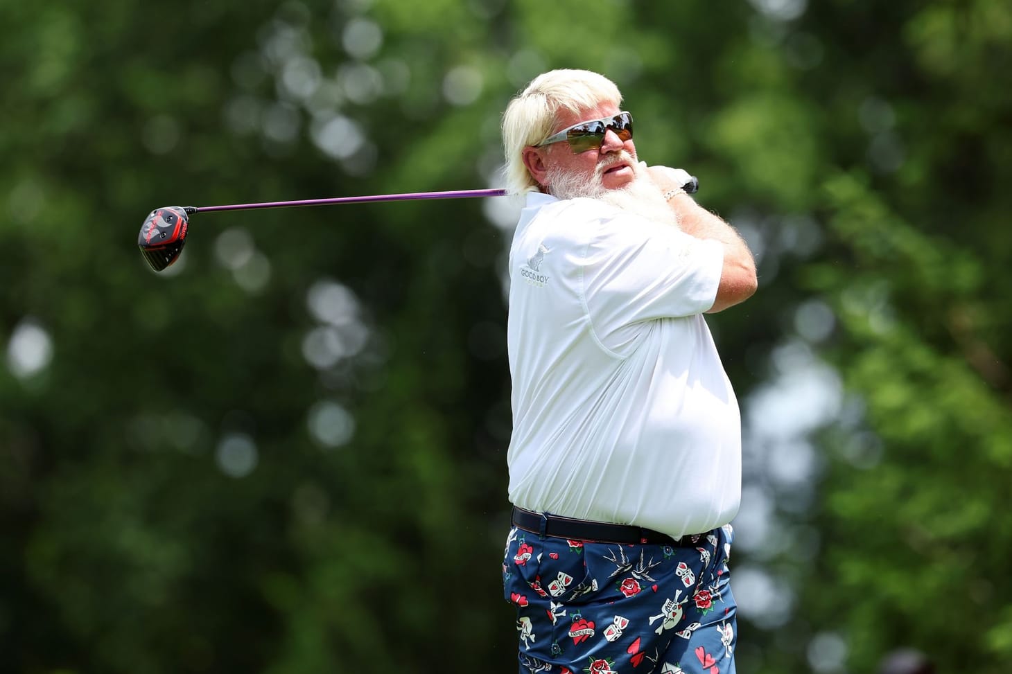 Watch: John Daly hits drivers over a highway onto a high school ...