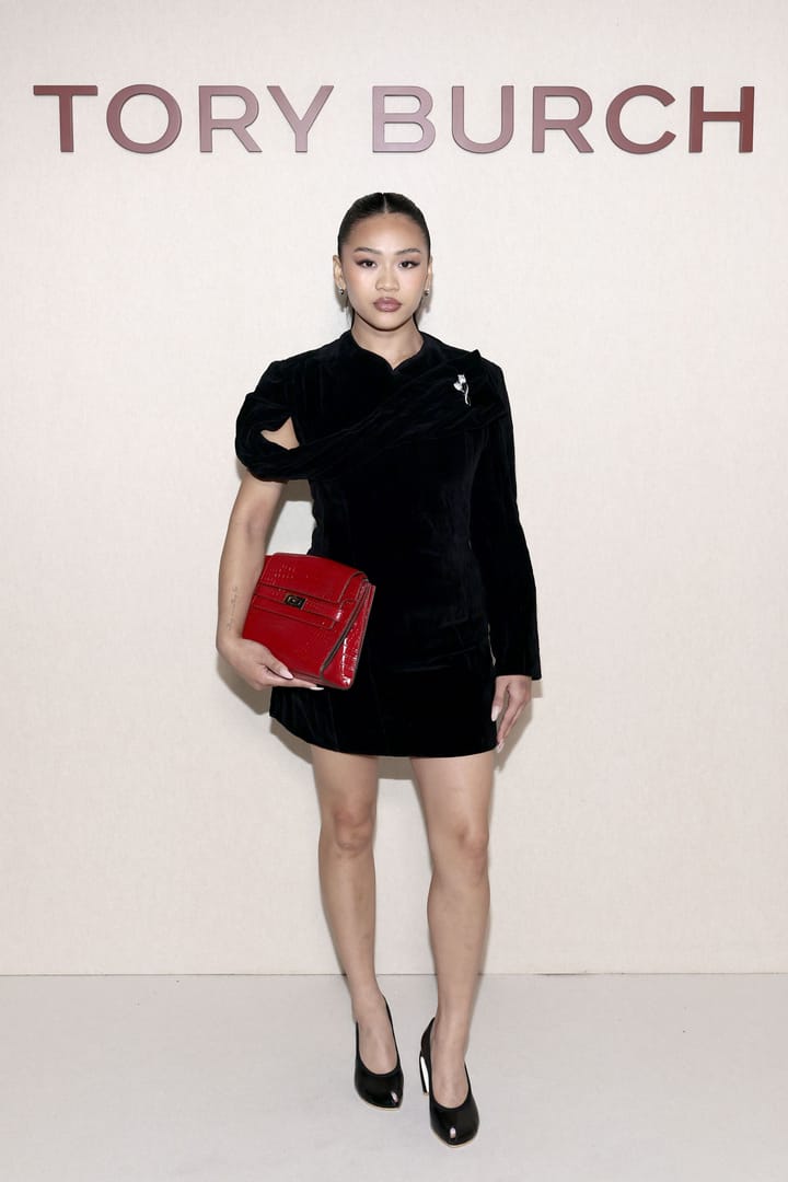 Suni Lee poses in brown blazer and slicked back hair as she turns heads ...