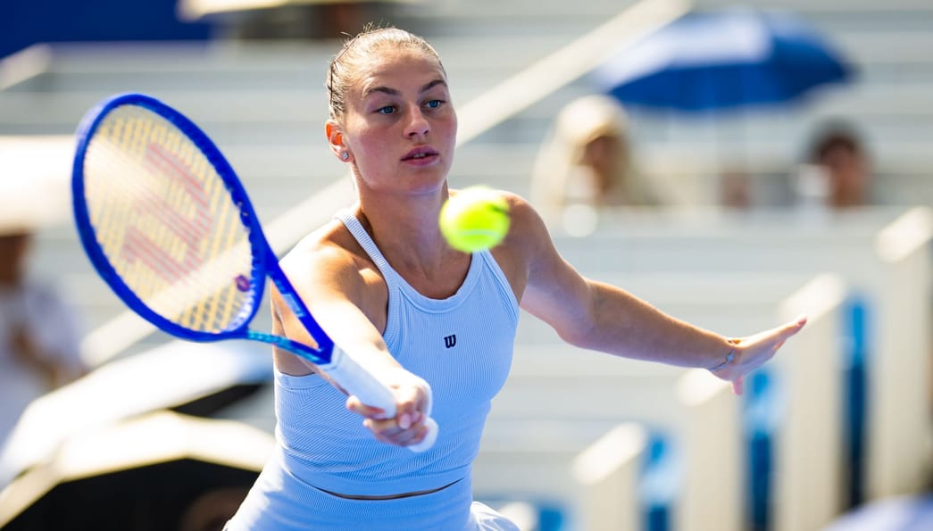 Marta Kostyuk Hits The Beach In Orange Swimwear Quickly Embraces