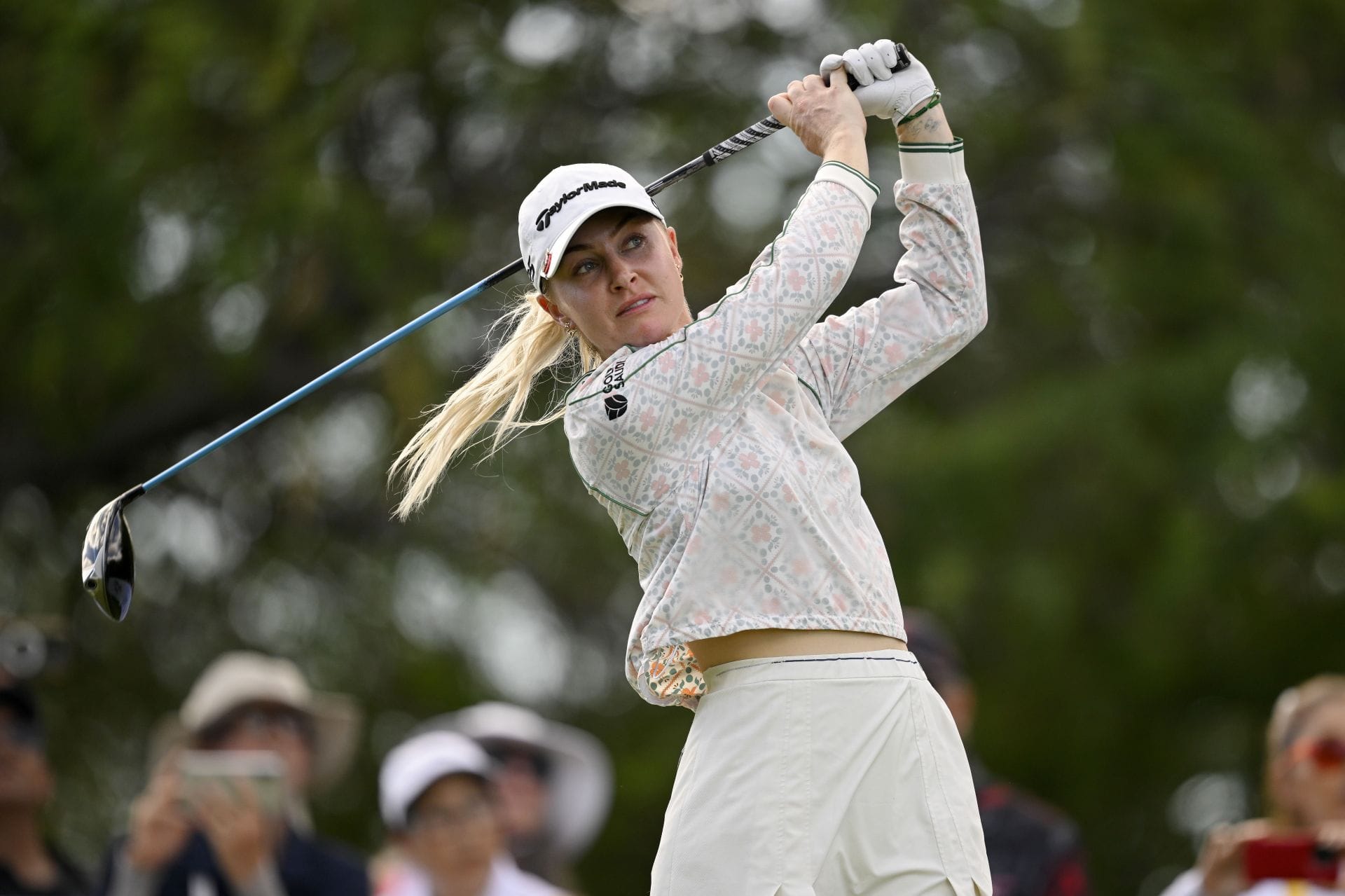Charley Hull goes all beige as she poses with the founders of Malbon
