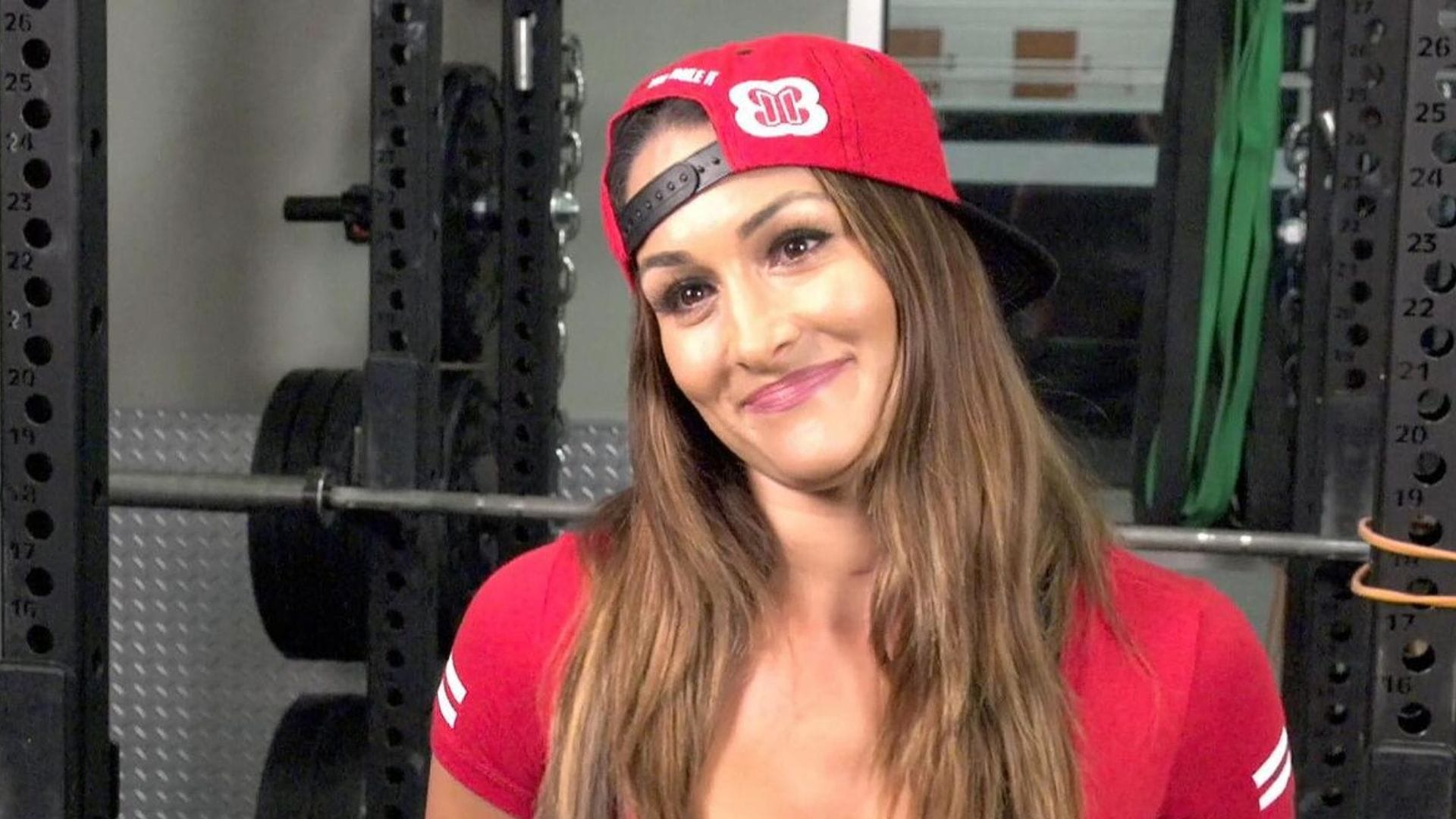Nikki Bella poses with a major title outside WWE