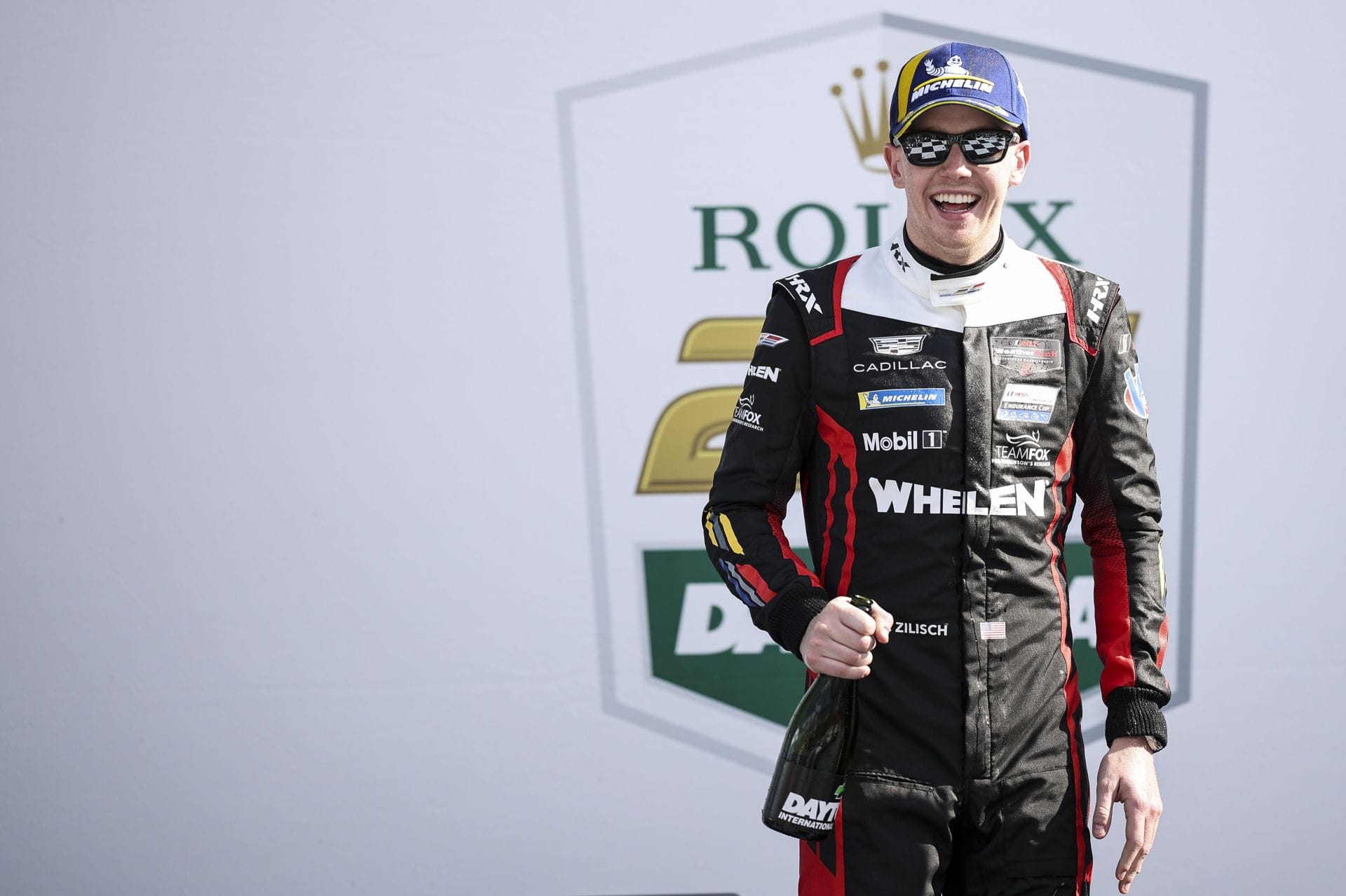 HMS legend Jimmie Johnson reacts as Connor Zilisch comes up a position ...