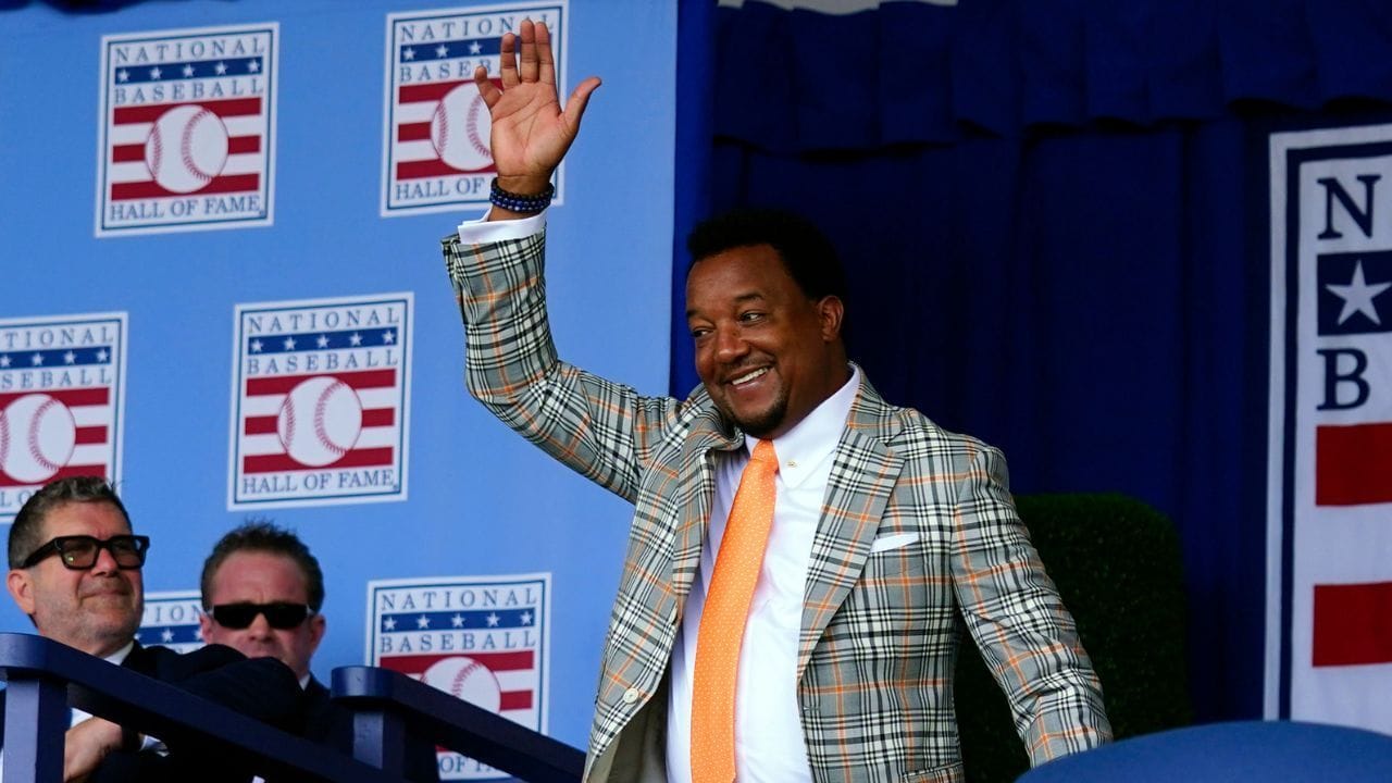 Pedro Martinez's wife Carolina turns heads in vibrant pink, floor ...