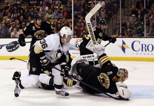 Penguins clinch top NHL seed with win over Bruins